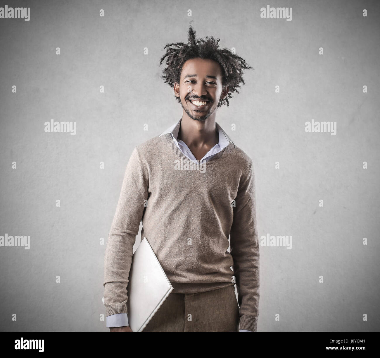 Young black man with laptop Stock Photo - Alamy