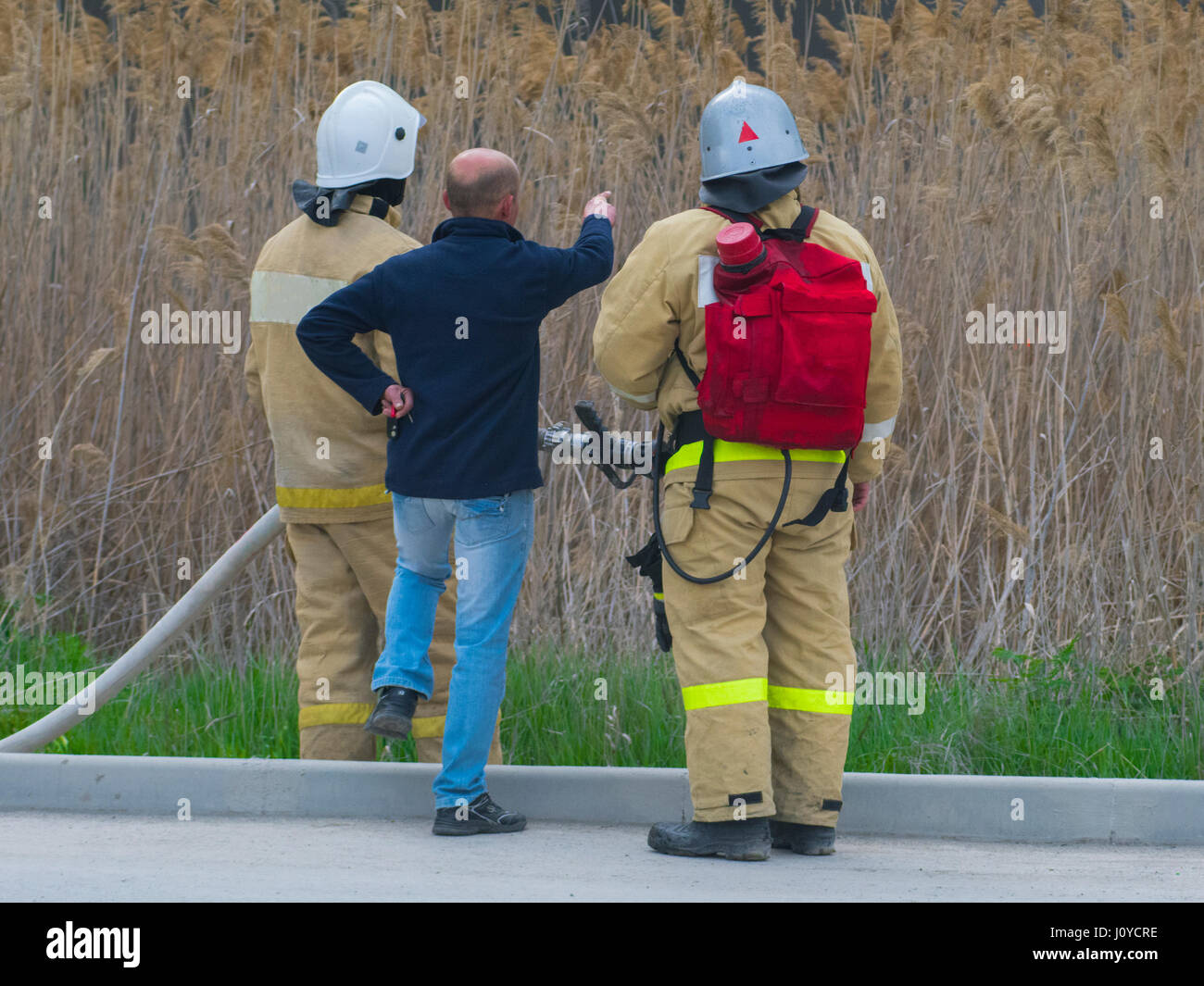 Firefighters with oxygen and hose hi-res stock photography and images ...
