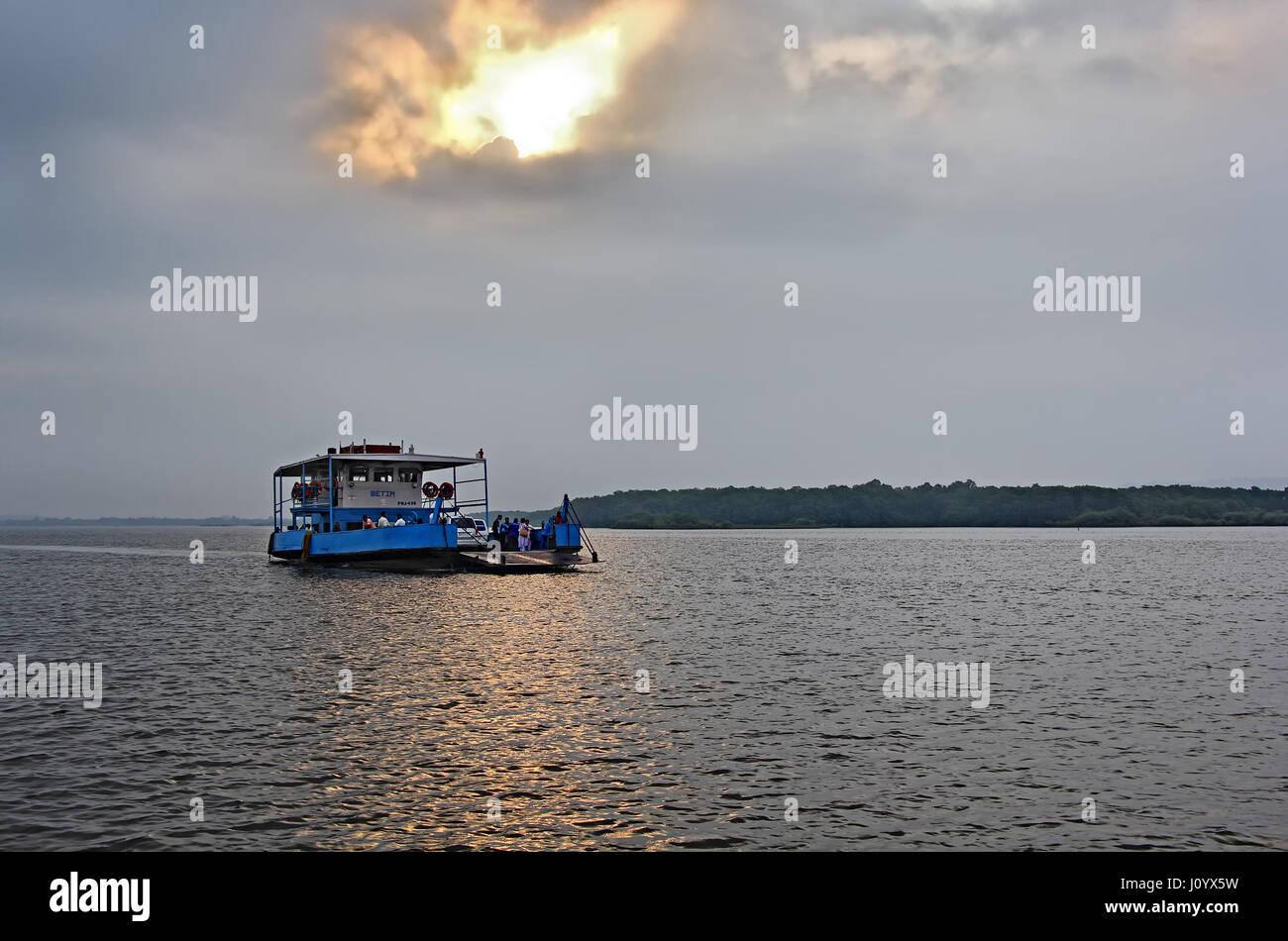 Ferry boat transfers passengers and vehicles during morning hours ...