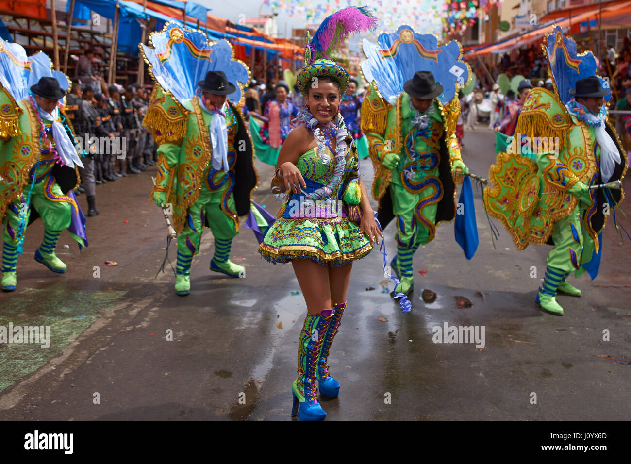 Morenada dance group in colourful outfits parading through the mining ...