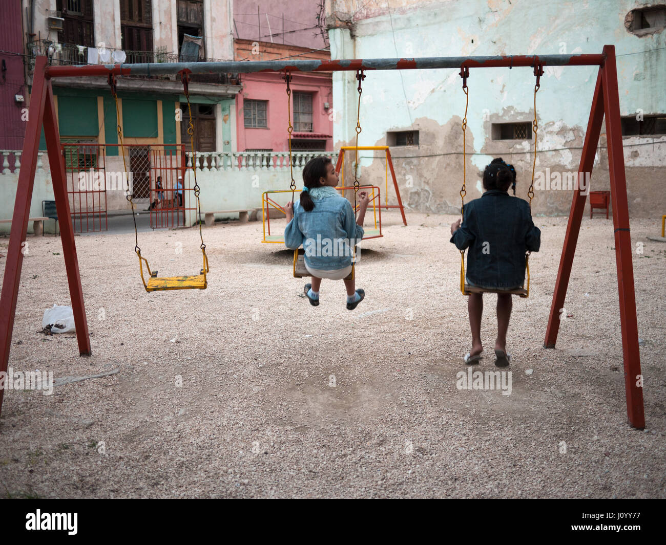 Cuban kids playing on a swing in Havana, Cuba Stock Photo - Alamy
