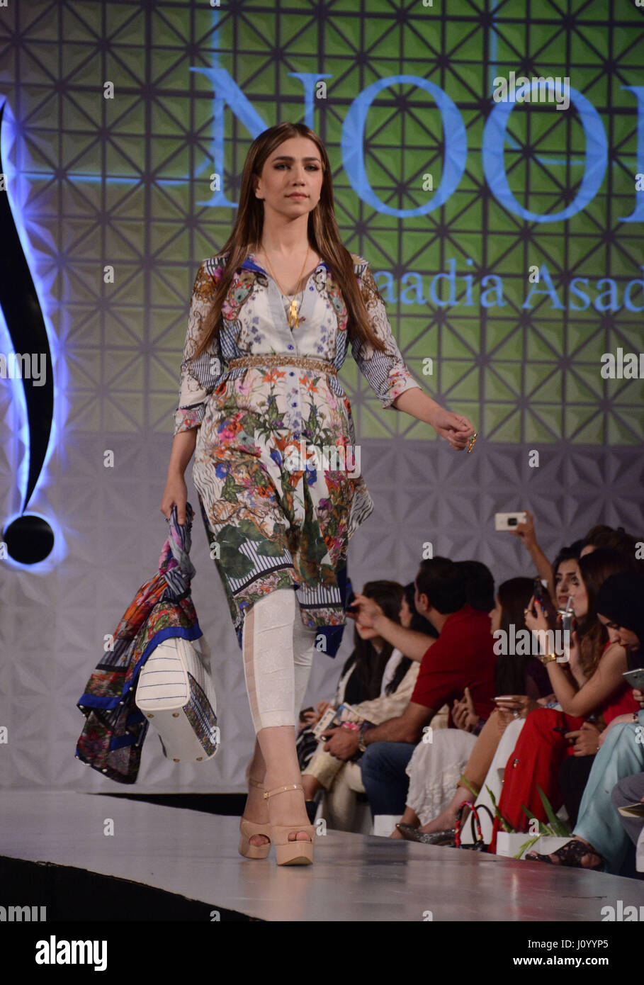 Lahore, Pakistan. 07th Aug, 2013. Pakistani model presents a creation by a famous fashion ...