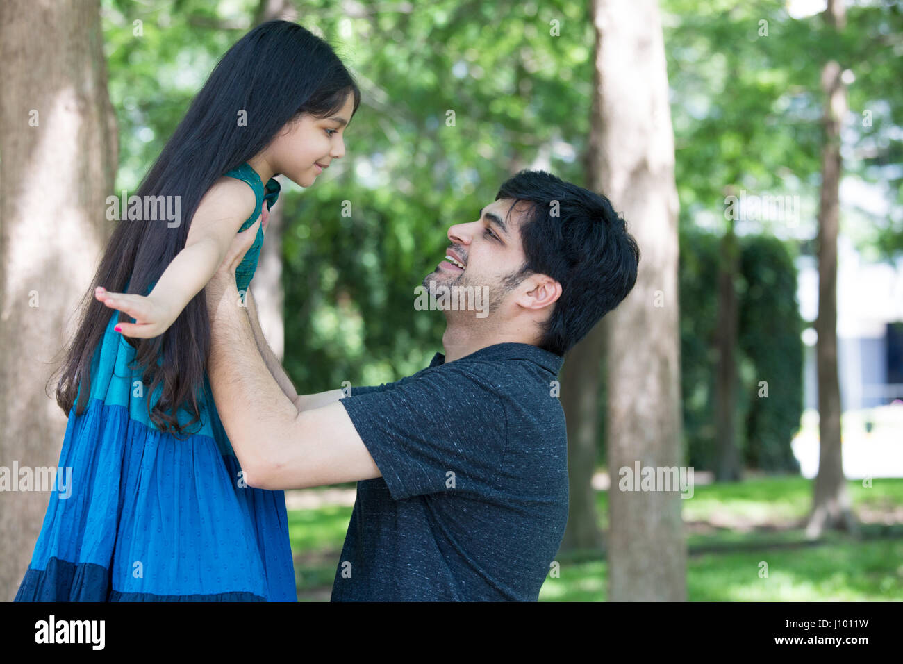 Closeup portrait, single dad and child having some fun outside in park ...
