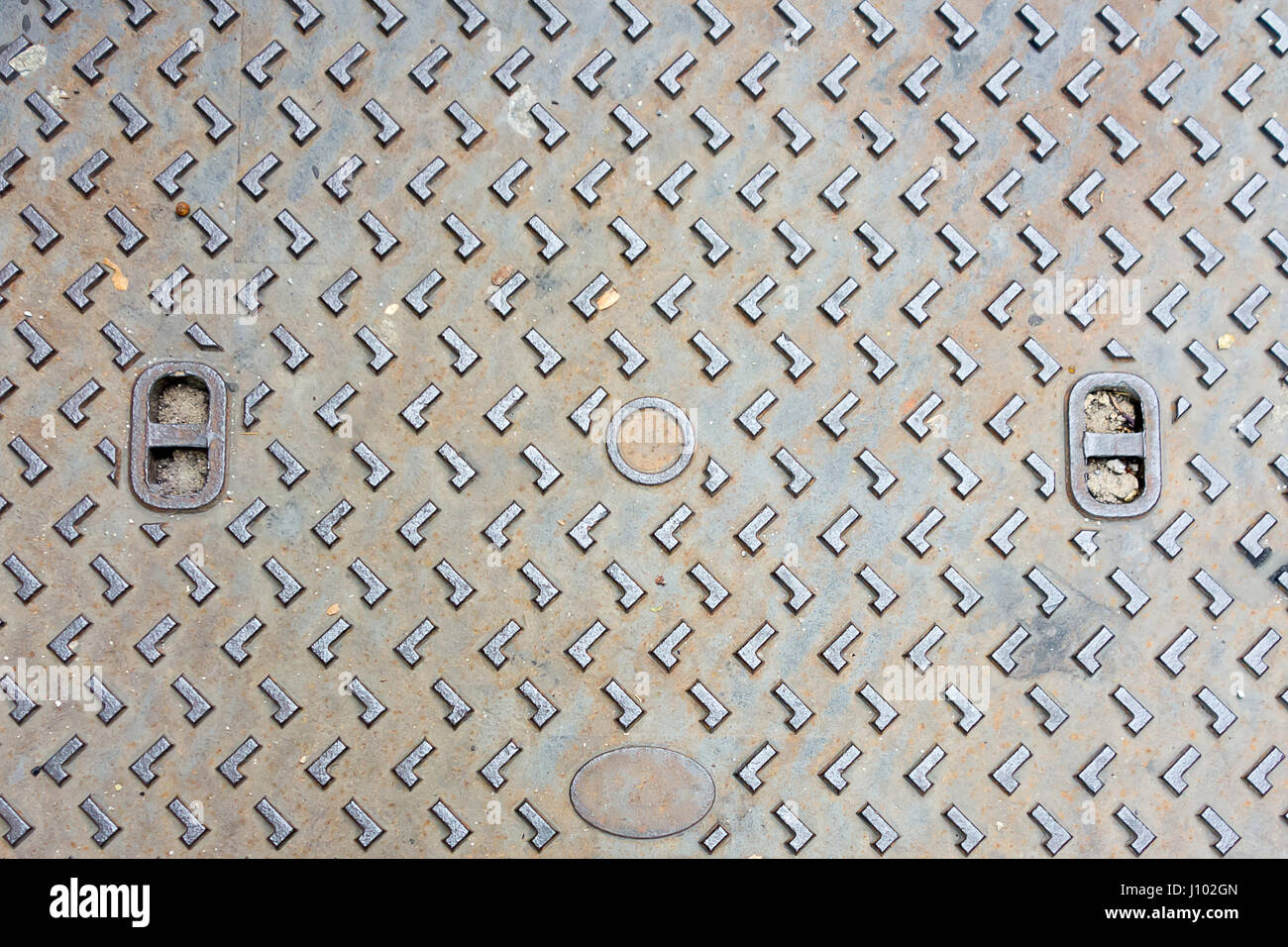 Rustic grunge manhole cover texture background Stock Photo - Alamy