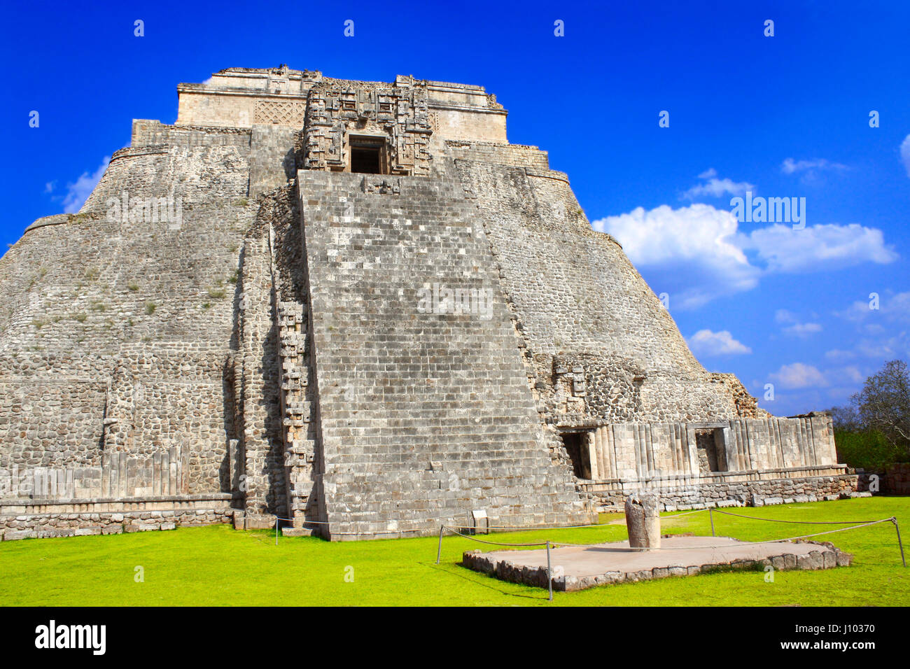 Ancient Mayan pyramid of the Magician in Uxmal with god Chaac masks ...