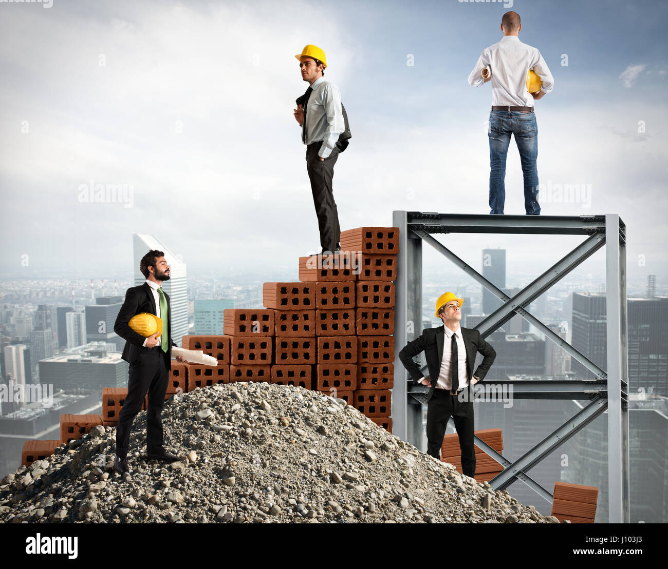 Businessmen work together to build a building Stock Photo - Alamy