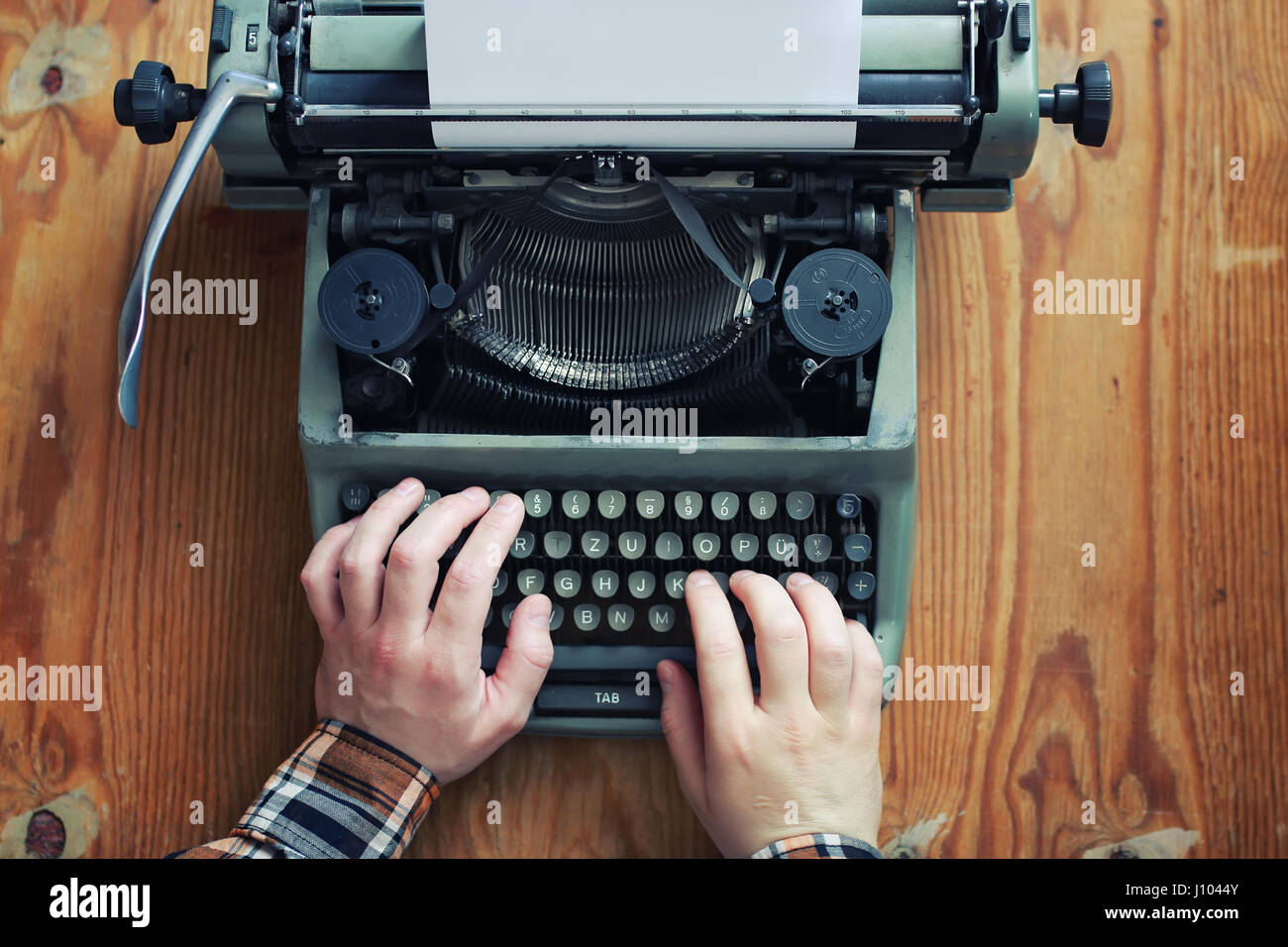 typewriter retro hand on wooden table Stock Photo - Alamy