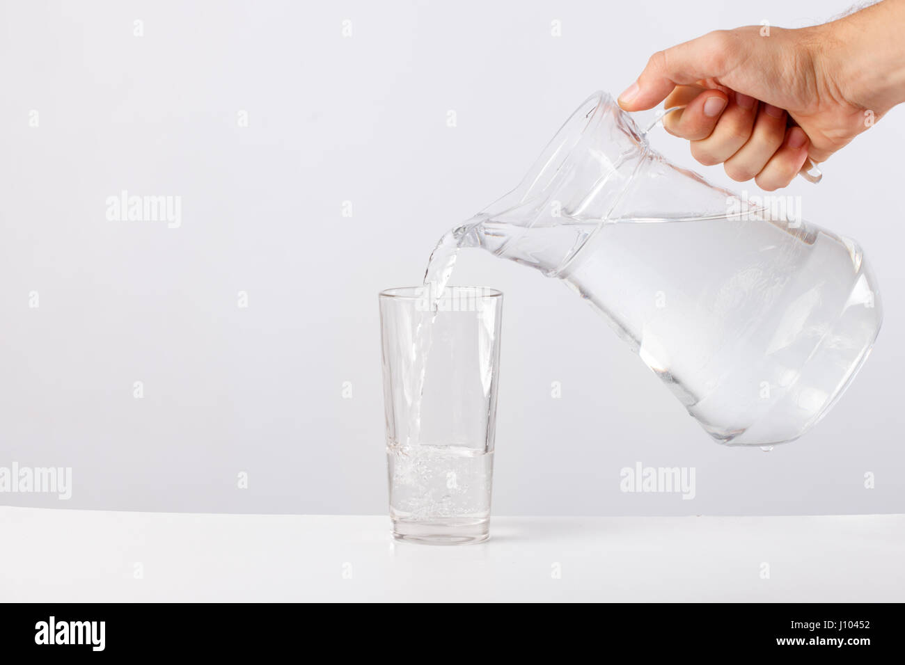 Jug pouring water glass hi-res stock photography and images - Alamy