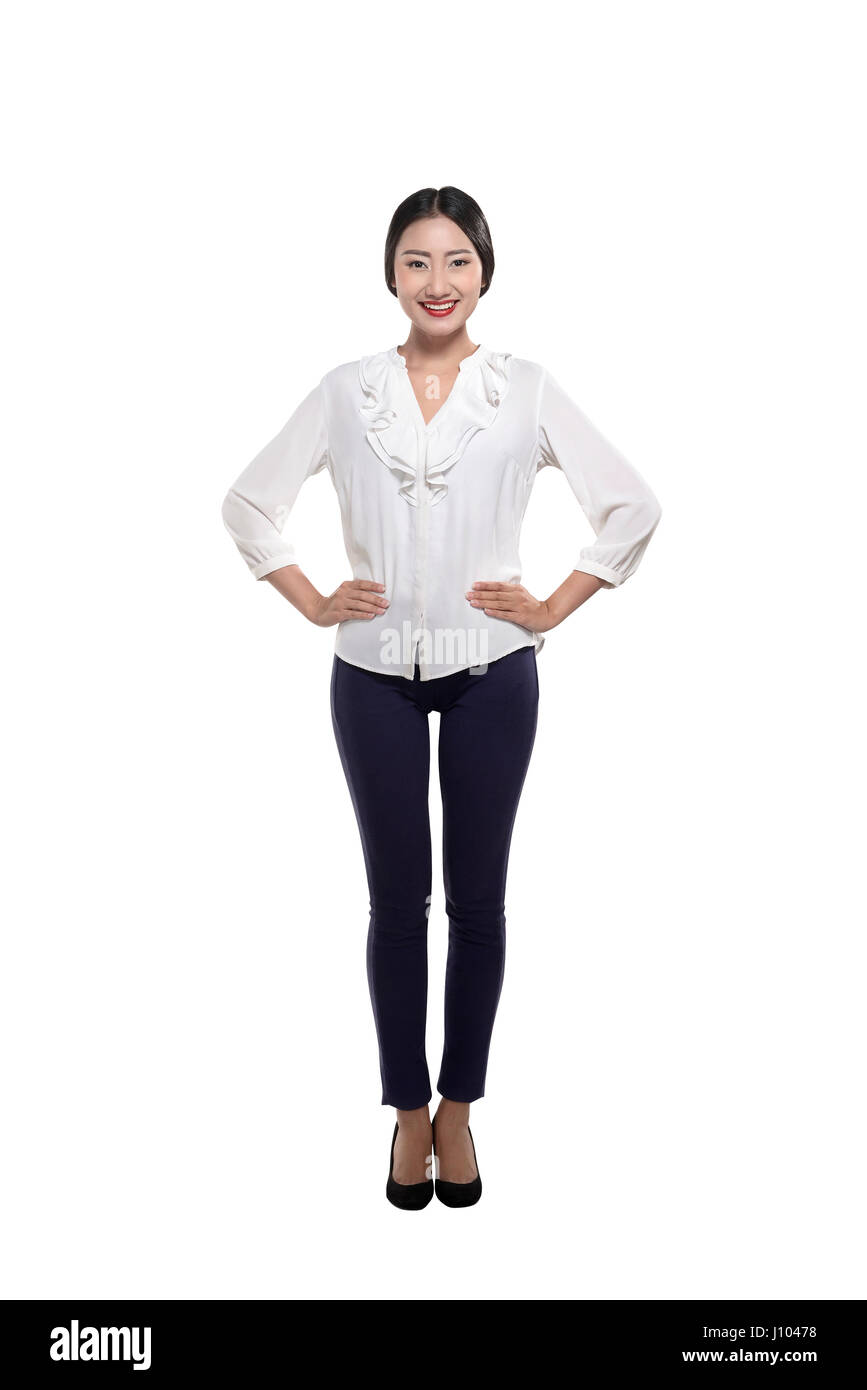 Beautiful asian business woman posing with hands on waist isolated over ...
