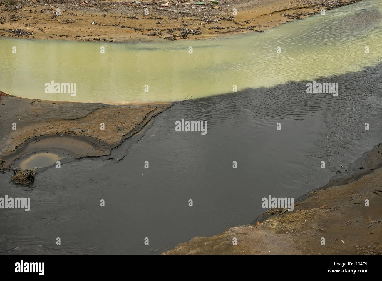 Two polluted rivers because of industrialization received a black and ...