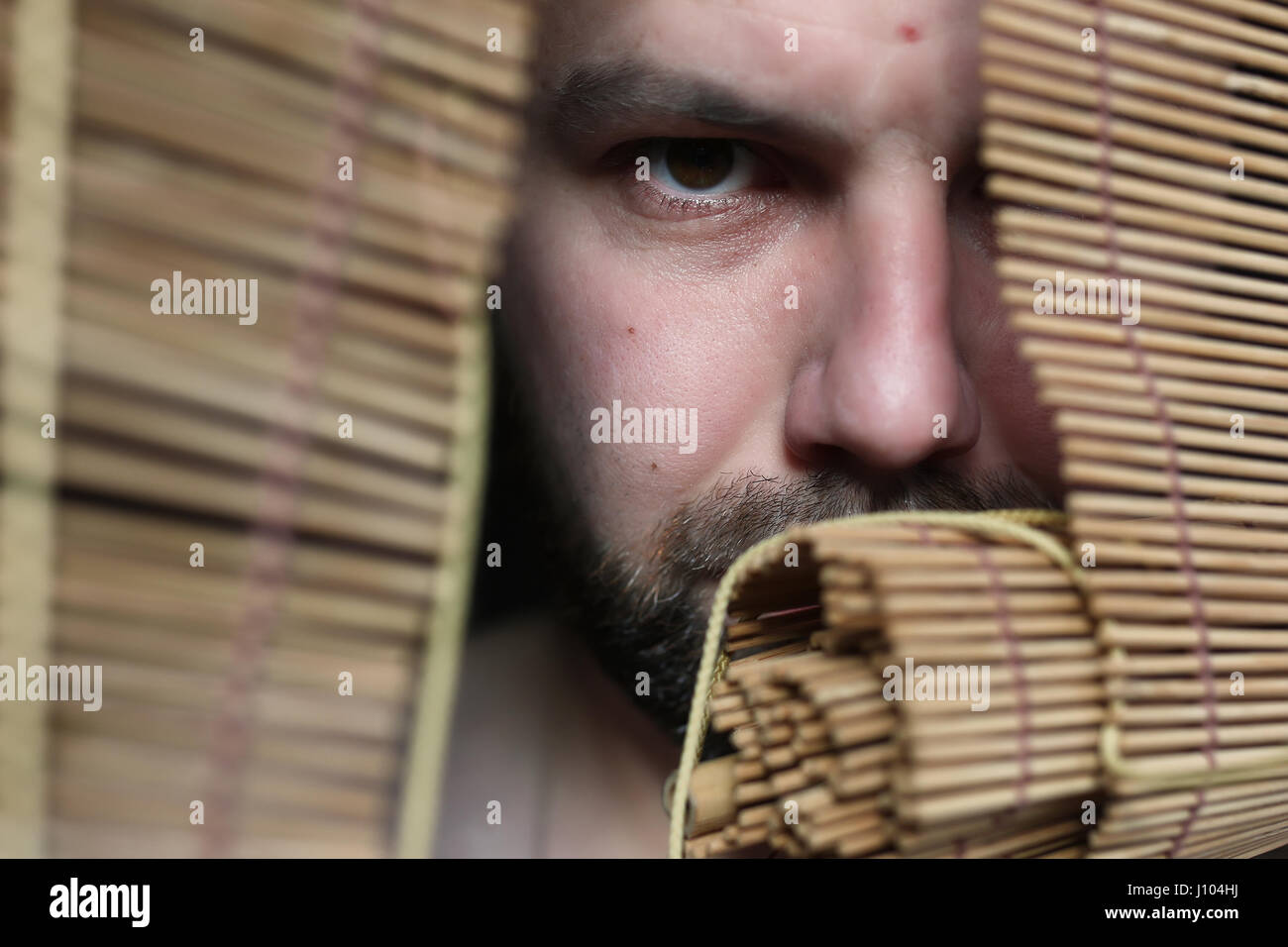 angry man at the jalousie Stock Photo - Alamy