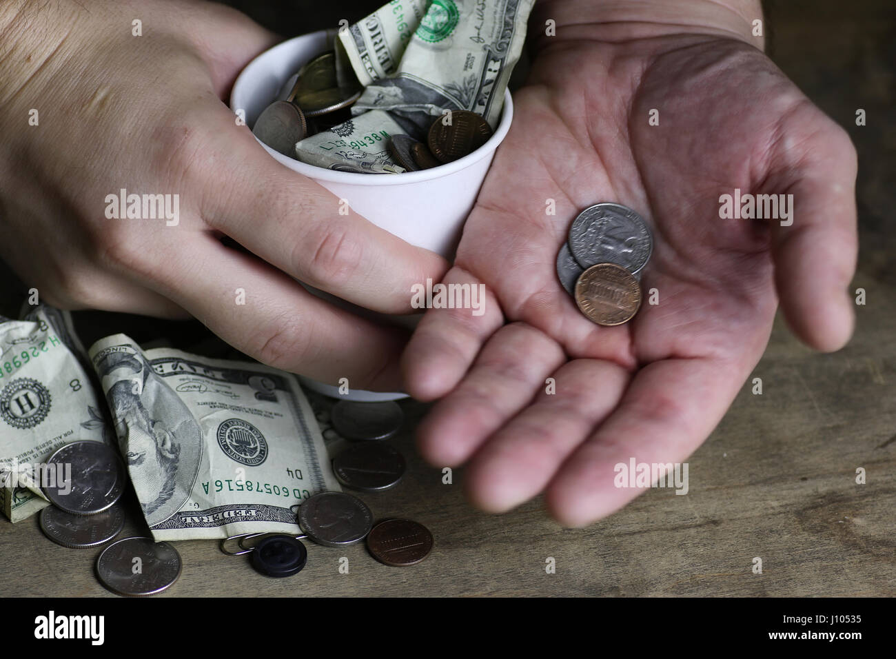 begging coin money Stock Photo - Alamy