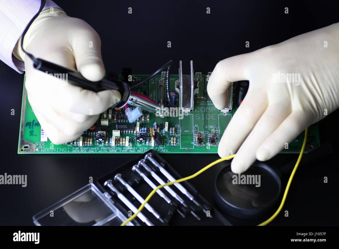 man hands chip soldering tools Stock Photo - Alamy