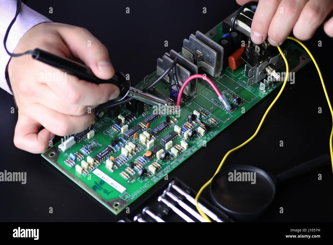 man hands chip soldering tools Stock Photo - Alamy