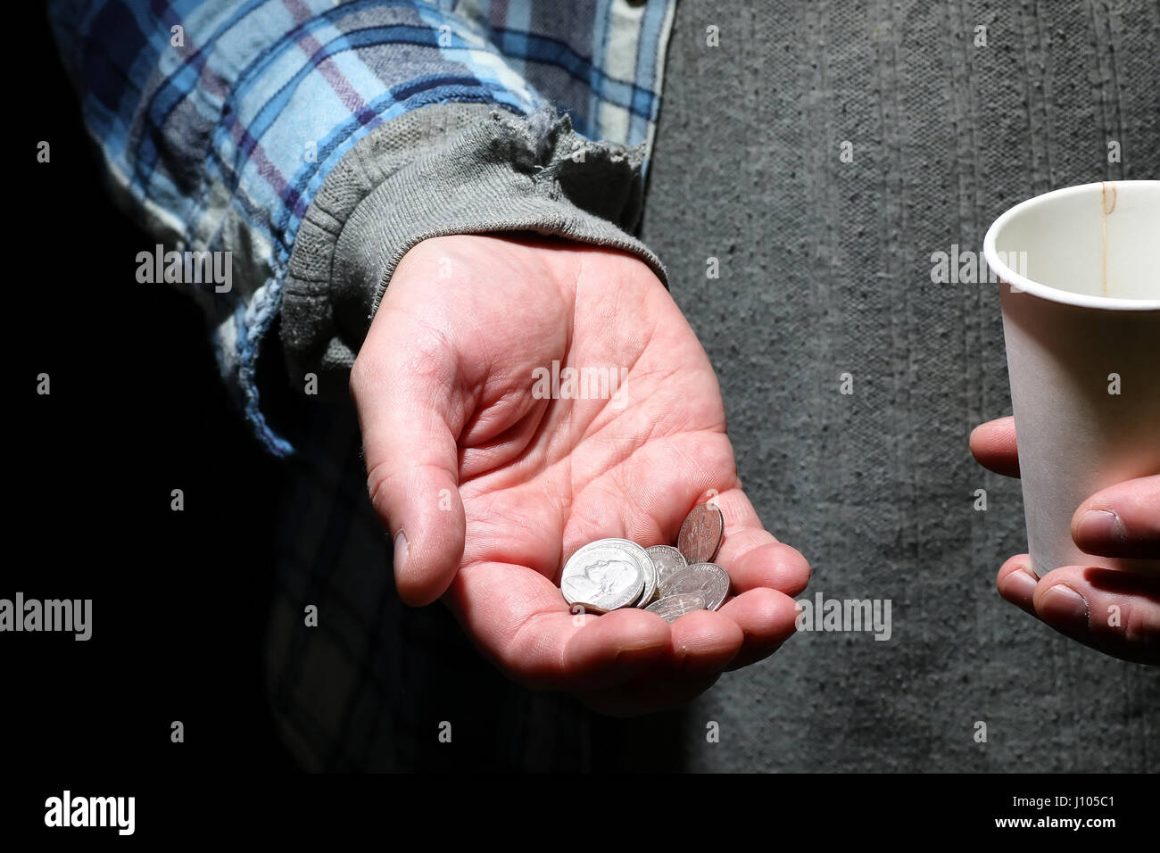 homeless man hand help Stock Photo - Alamy