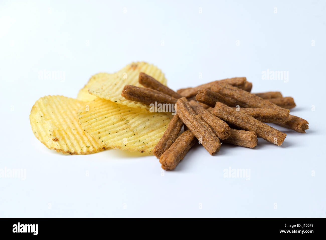 Chips and crackers on a white background as a cold appetizer Stock ...