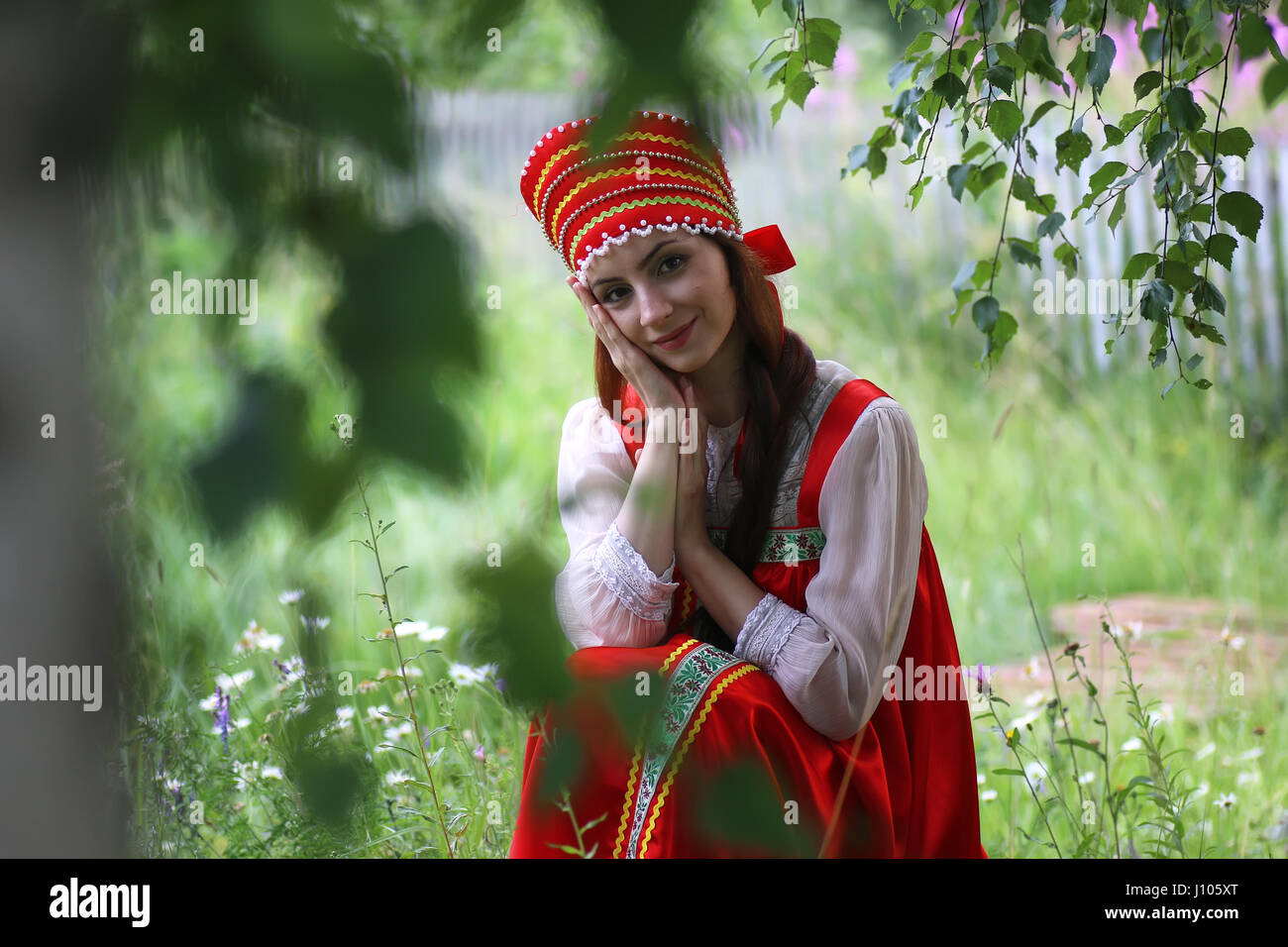 Slav in traditional dress is sitting in nature Stock Photo - Alamy