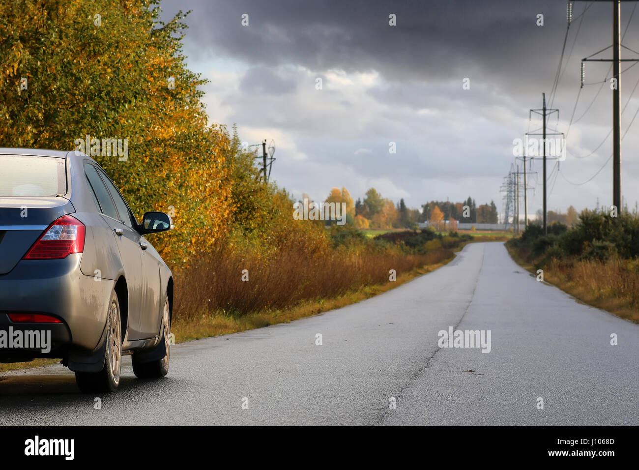 car on country road lane Stock Photo - Alamy