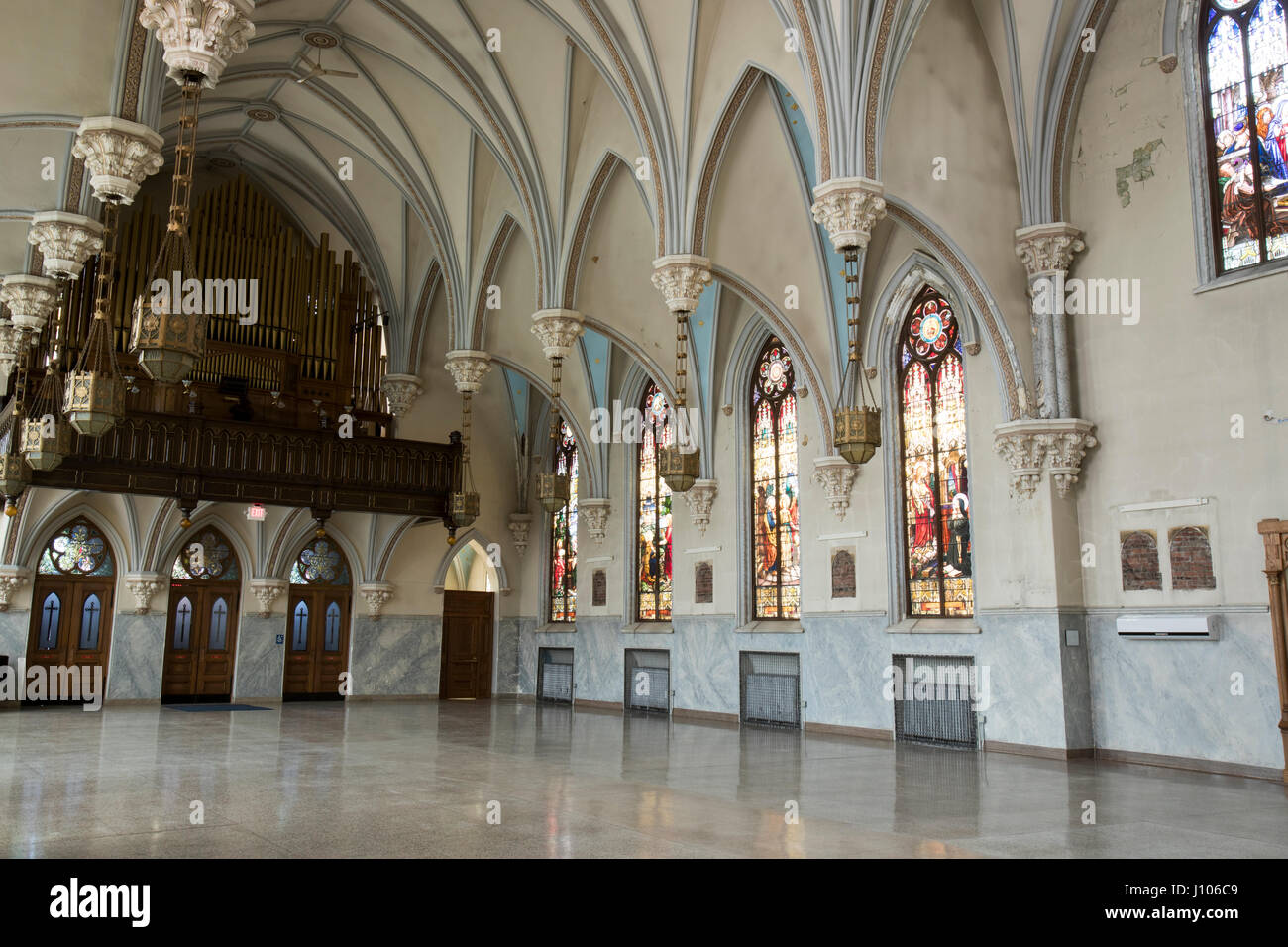 Hall and pipe organ balcony in abandoned German Catholic church Stock ...