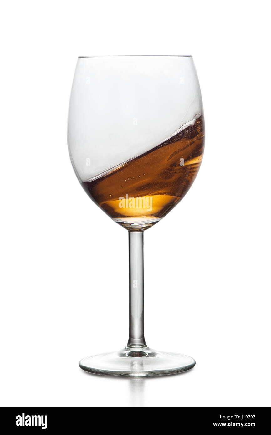 Splashing drink in glass isolated on white background Stock Photo - Alamy