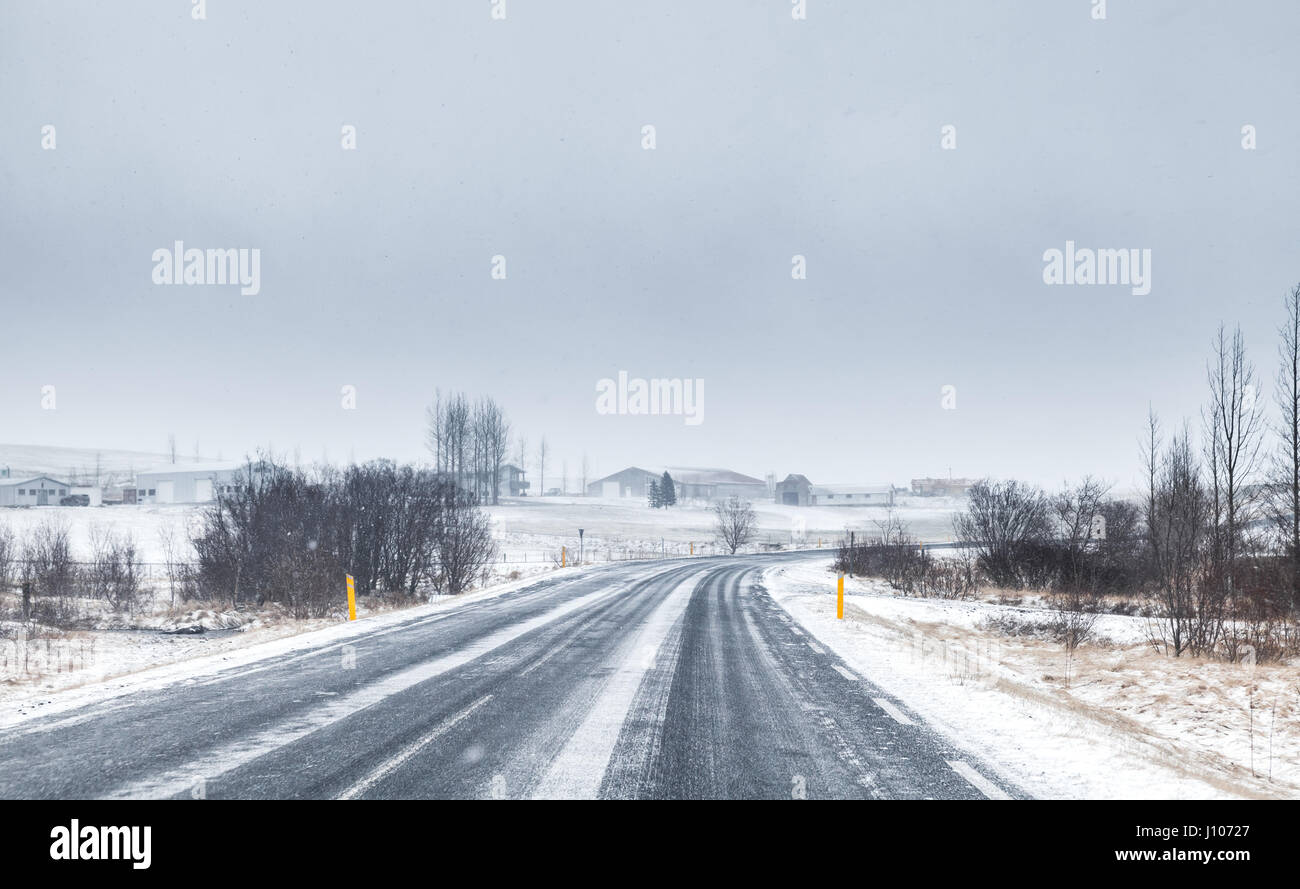 Snowy Icelandic road perspective, empty rural landscape Stock Photo - Alamy