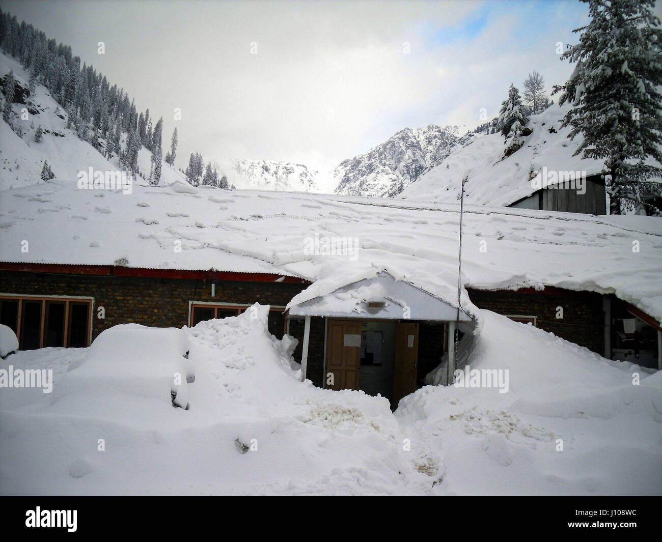 Snow covered buildings and houses Stock Photo - Alamy