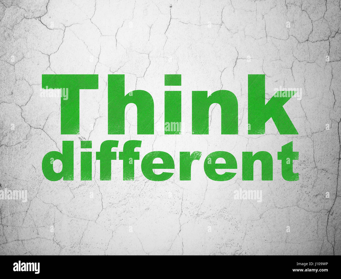 Learning concept: Think Different on wall background Stock Photo - Alamy
