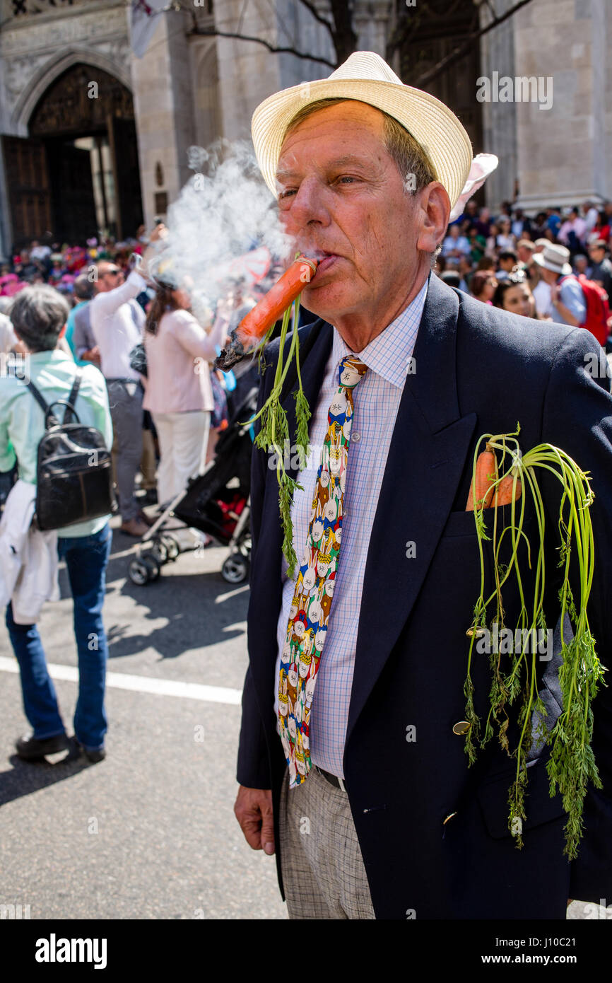 New York, USA. 16th Apr, 2017. A man smokes an orange cigar in the ...
