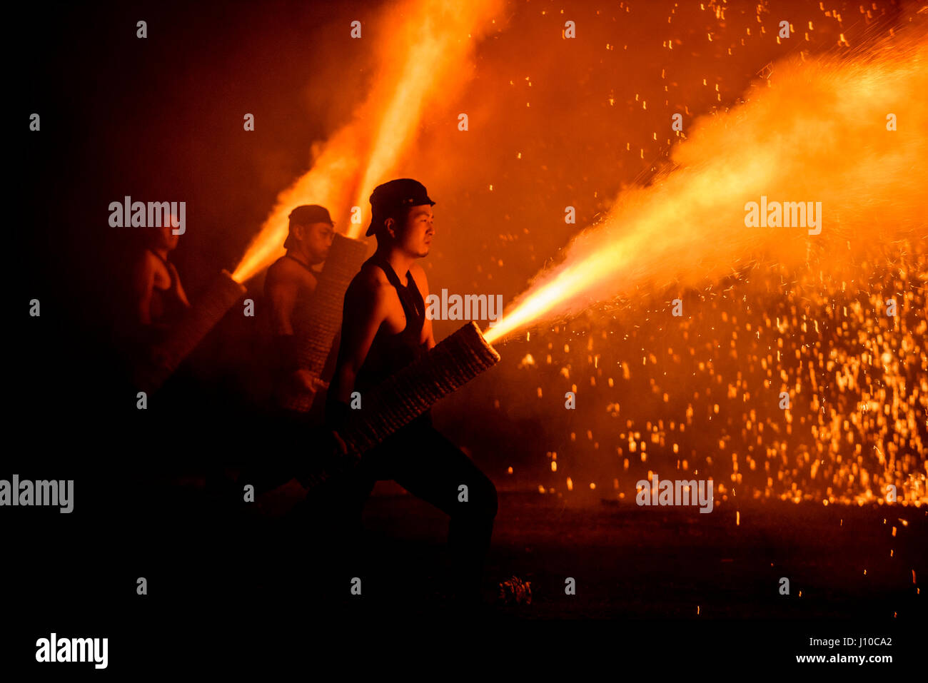 APRIL 15, 2017 - Men launch handheld fireworks, known as tezutsu hanabi ...
