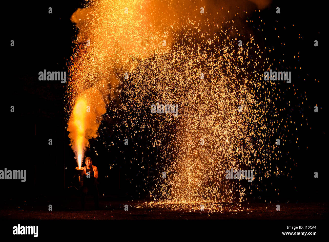 APRIL 15, 2017 - Men launch handheld fireworks, known as tezutsu hanabi ...