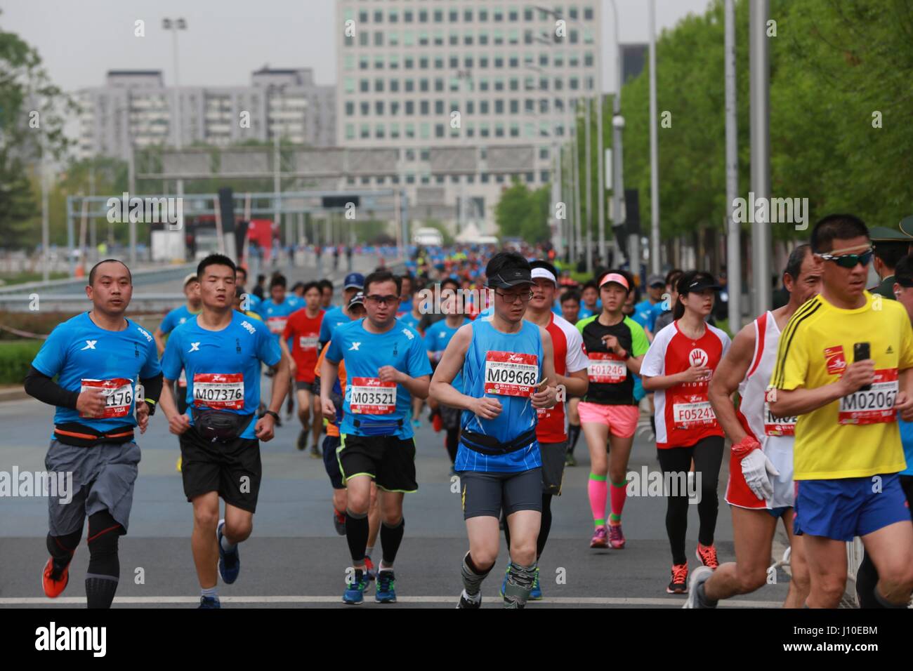 Beijing, China. 17th Apr, 2017. More than 21,000 runners from about 20 ...