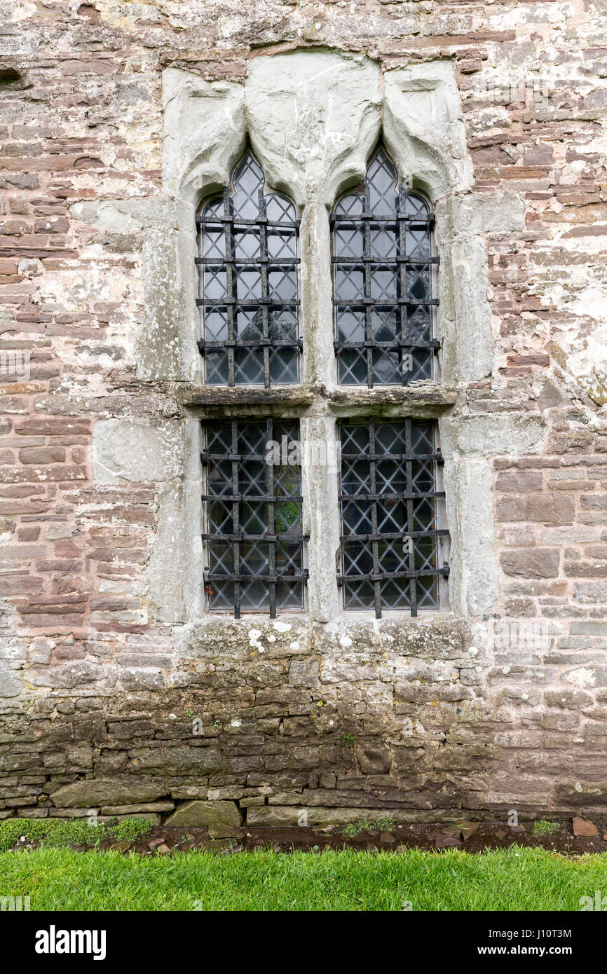 Old window with leaded panes leaning in wall, Tretower Court, Wales, UK ...