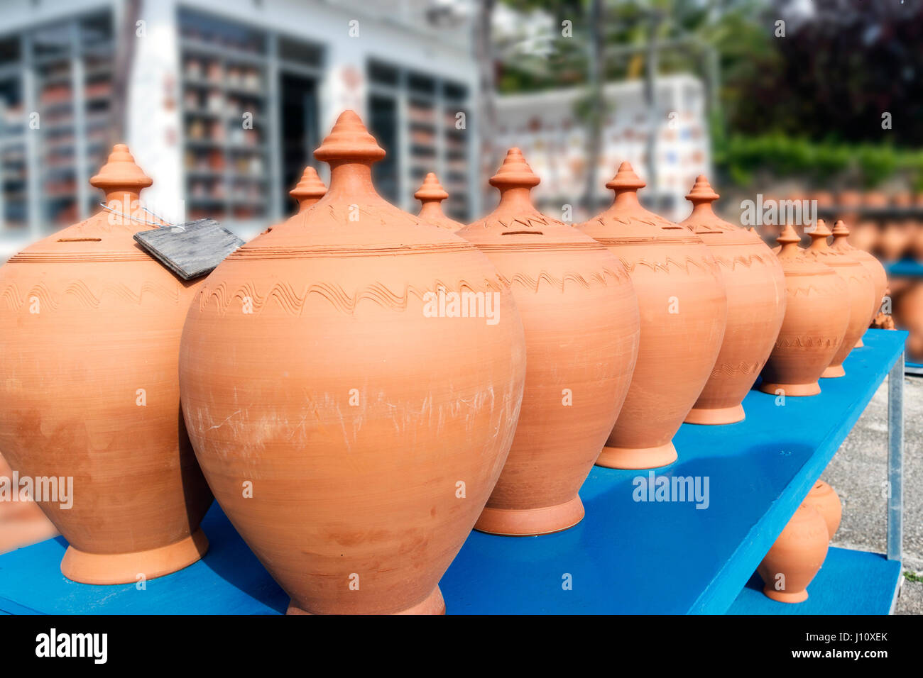 Group of red handmade ceramic jugs Stock Photo - Alamy