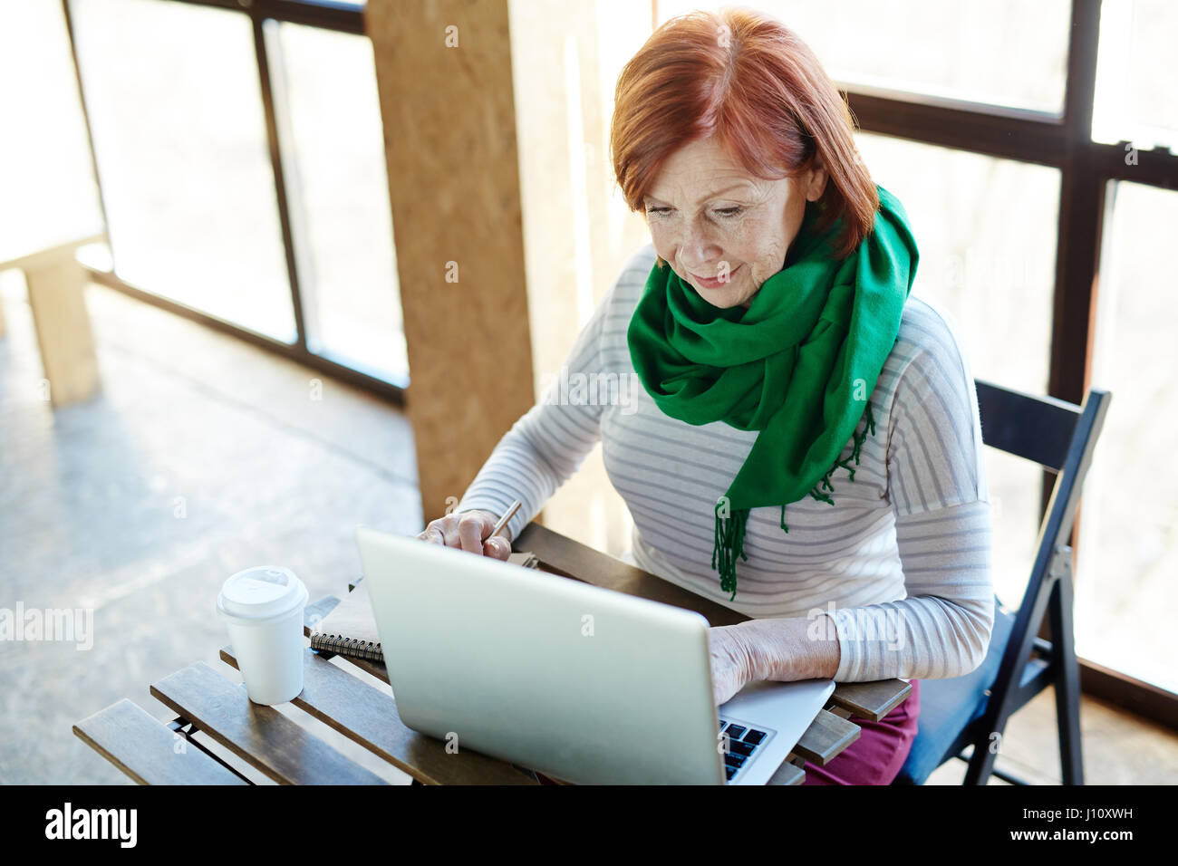 Senior female networking in cafe Stock Photo - Alamy