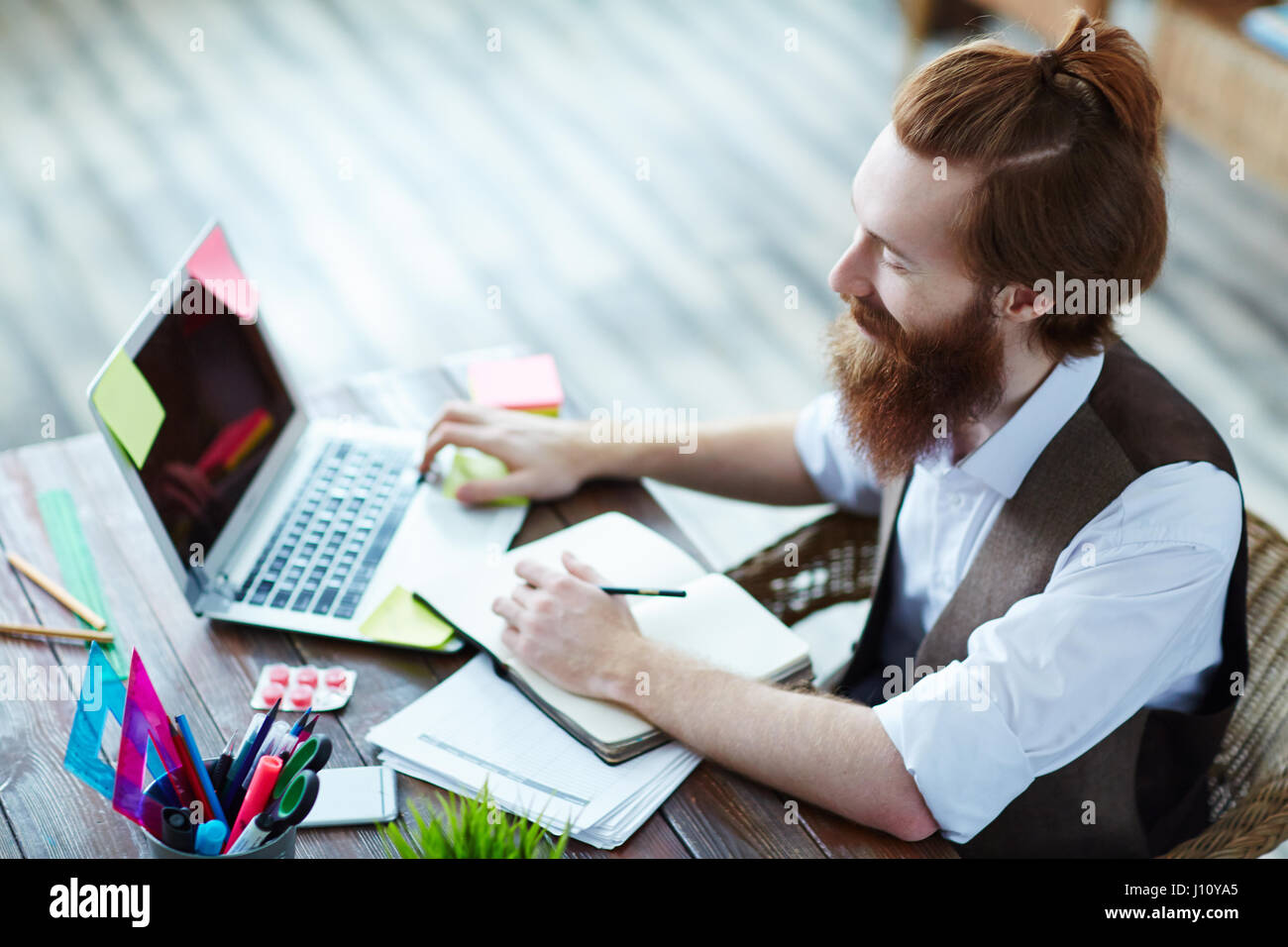 Young web-designer searching for data in the net Stock Photo - Alamy