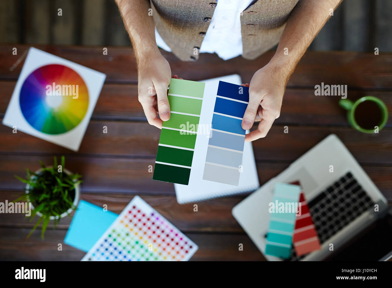 Color swatches in hands of interior-designer Stock Photo - Alamy