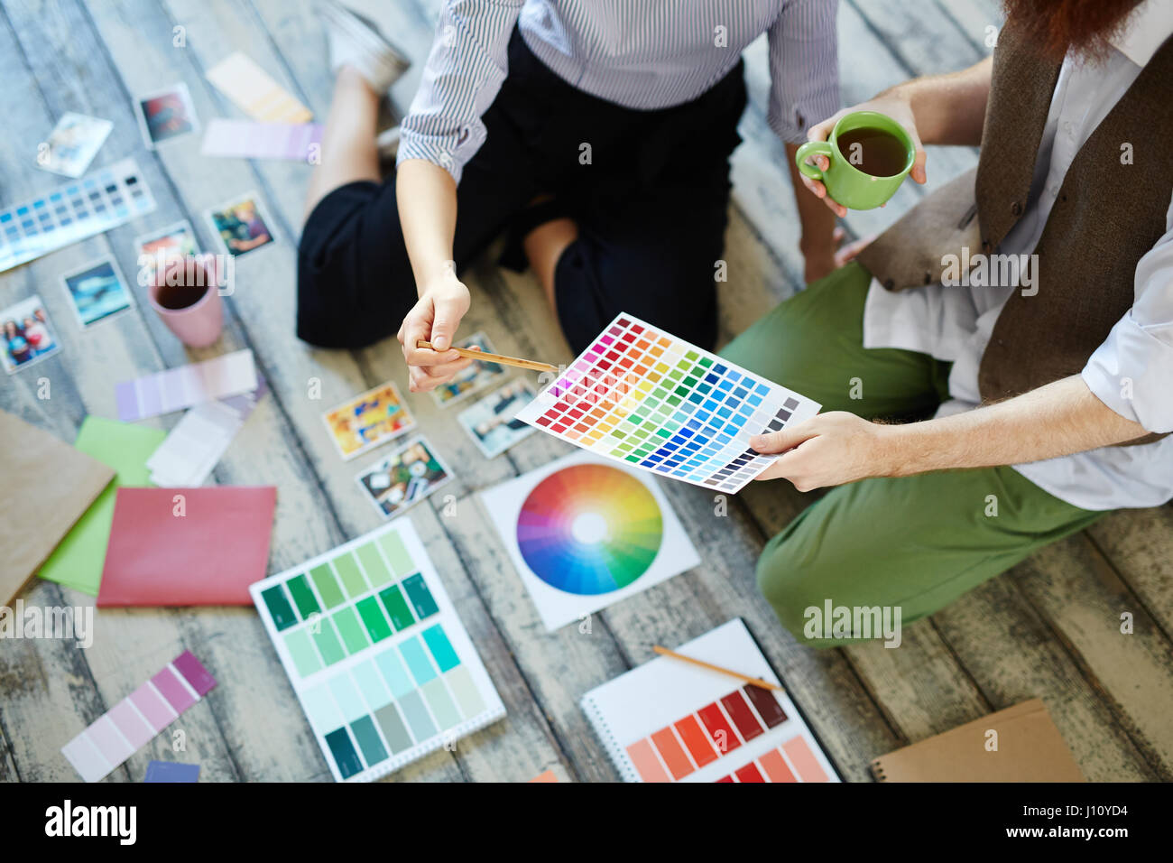 Designers discussing which color to choose for interior Stock Photo - Alamy