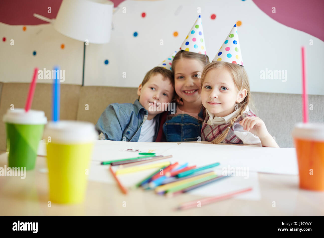Affectionate kids having birthday party in cafe Stock Photo - Alamy