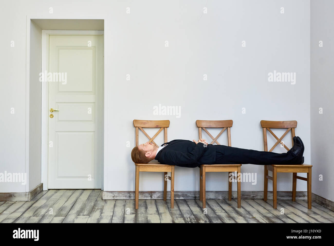 Portrait man lying on chair hi-res stock photography and images - Alamy