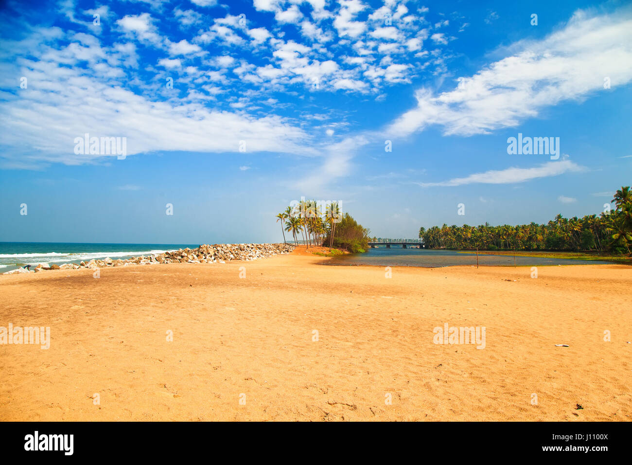 Tropical landscape with blue sky and palm trees. Beautiful beach Kappil ...