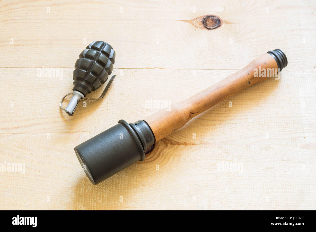 Two kinds of Grenades on wooden board Stock Photo - Alamy