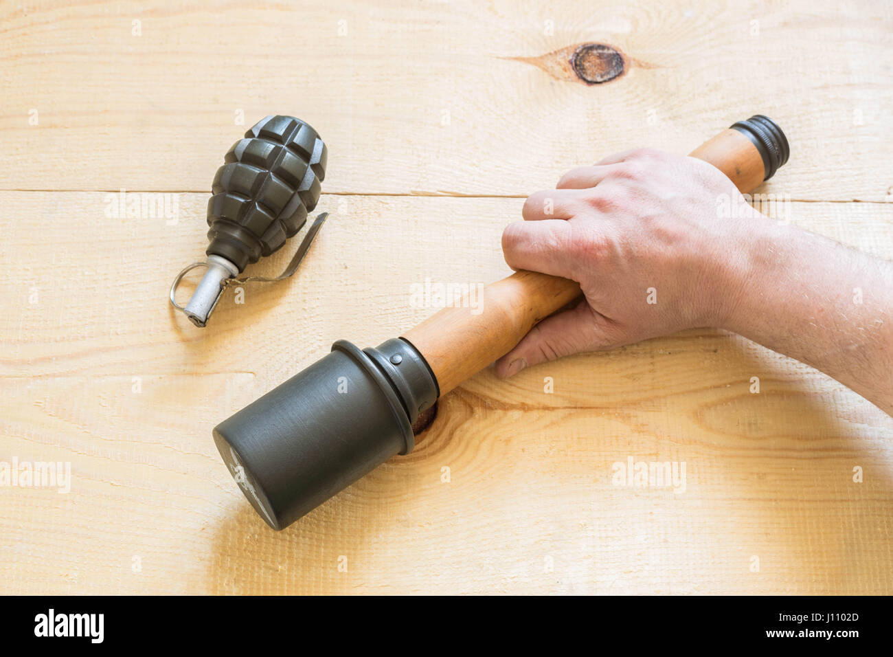 Two kinds of Grenades on wooden board Stock Photo - Alamy