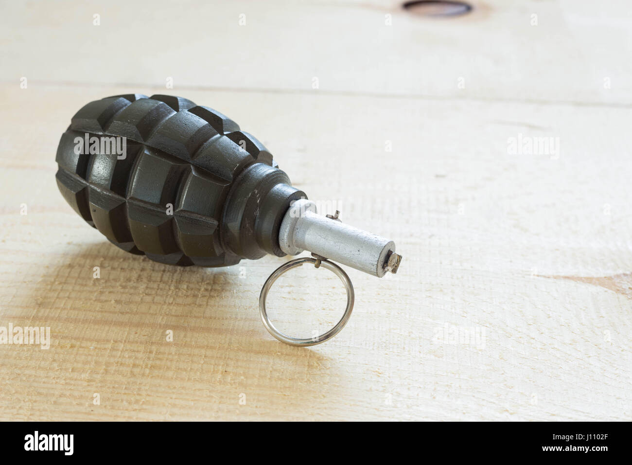 Hand grenade lying on the stones Stock Photo - Alamy
