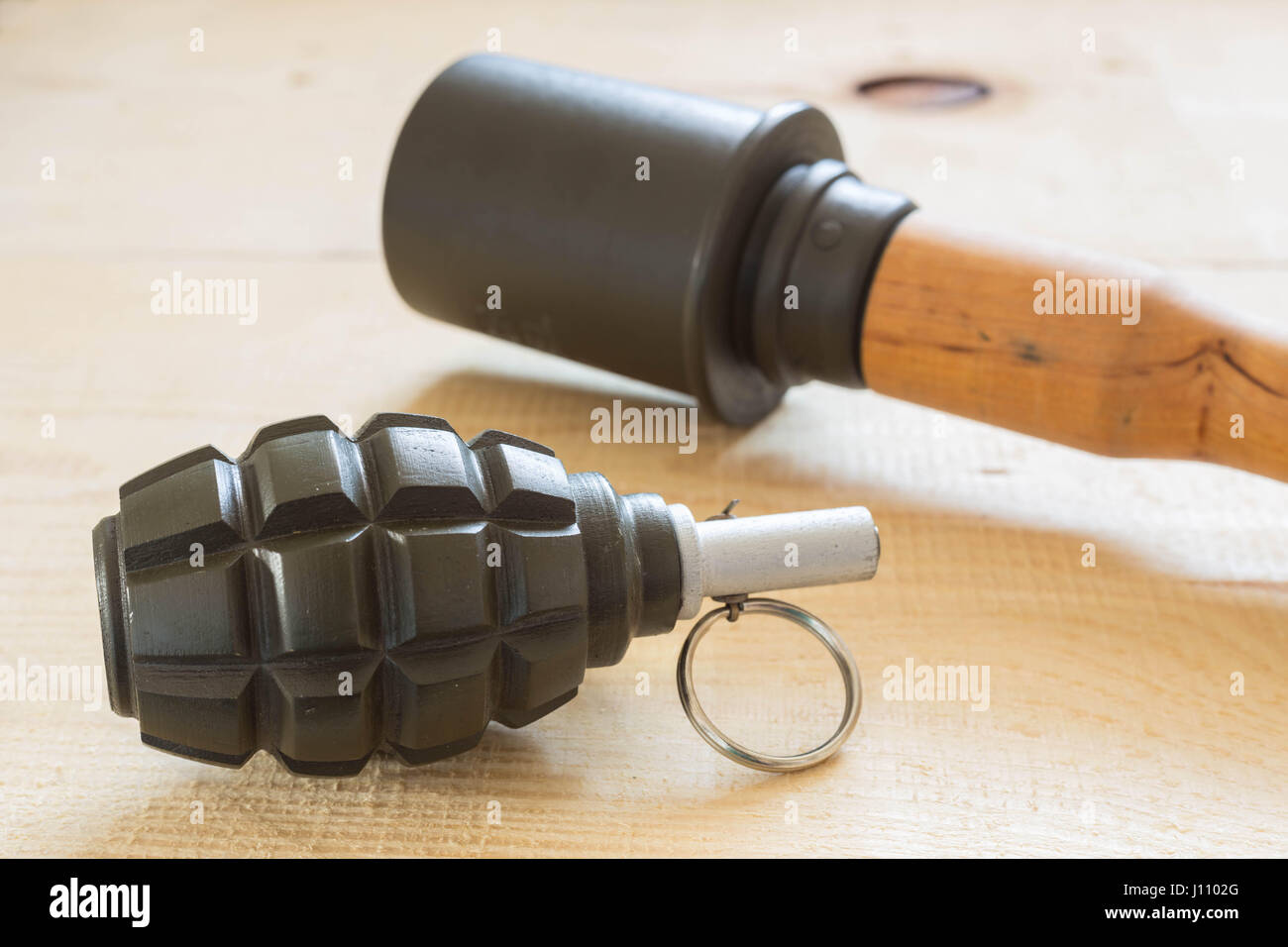 Two kinds of Grenades on wooden board Stock Photo - Alamy