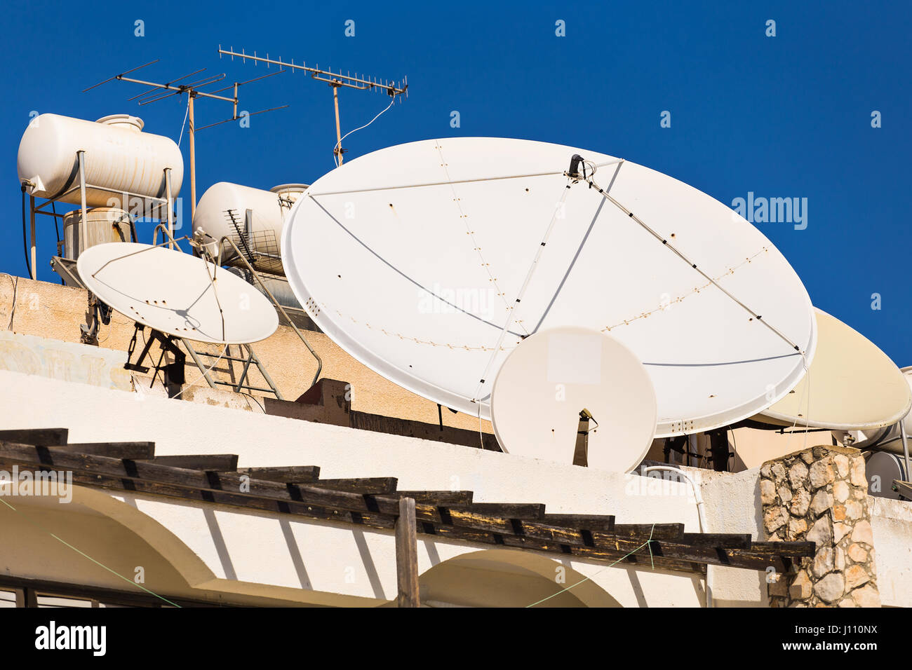 Satellite dish on the roof Stock Photo - Alamy