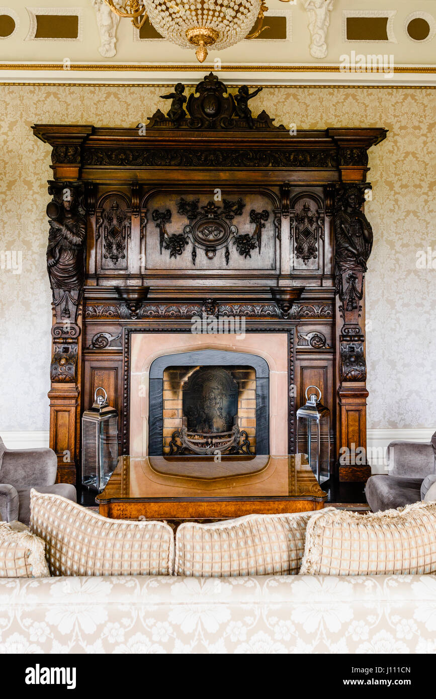 Large oak hearth around the fireplace in a posh sitting room Stock ...