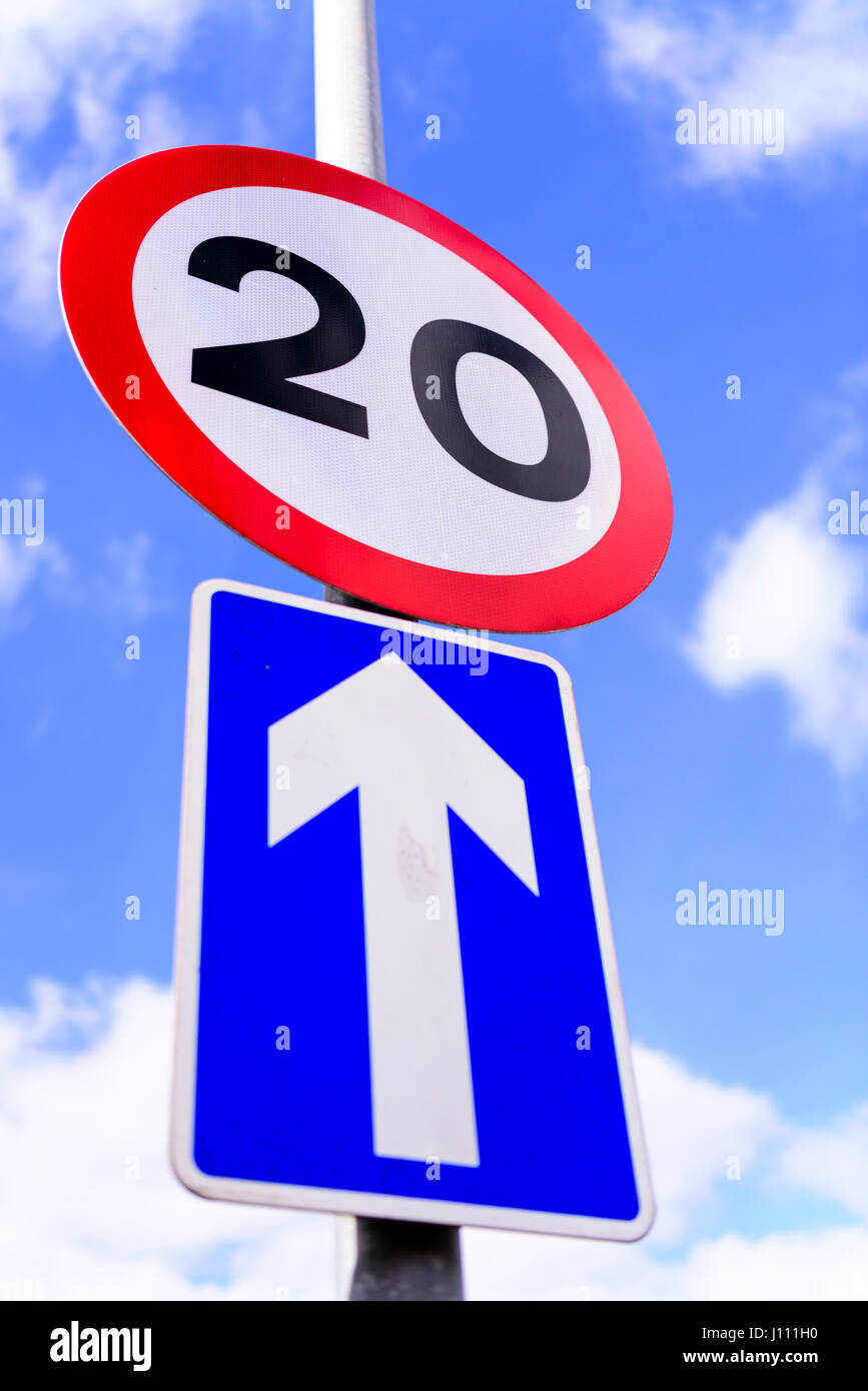 20mph road sign and a one-way system road sign Stock Photo - Alamy