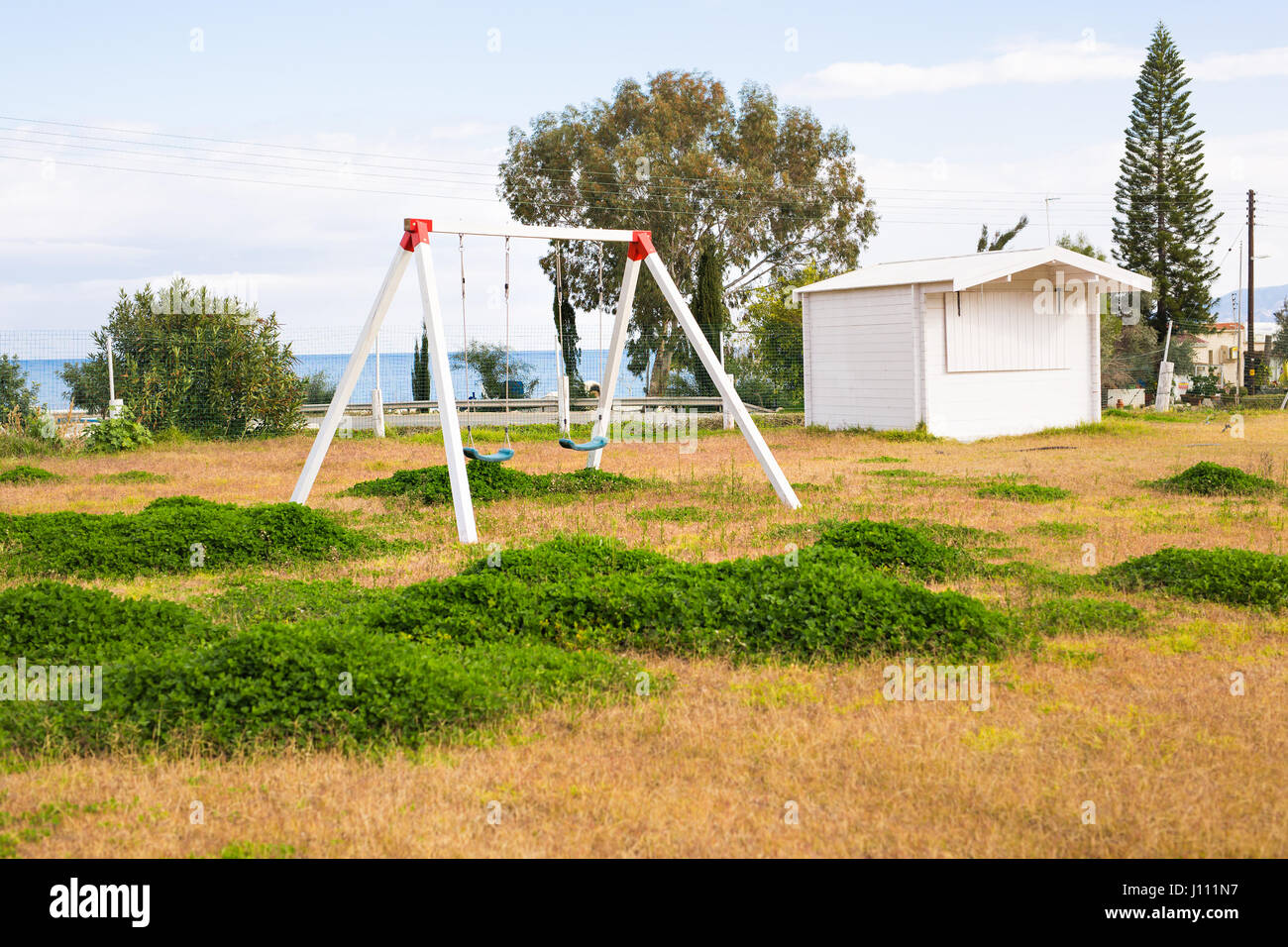 Children swing at Playground Stock Photo - Alamy