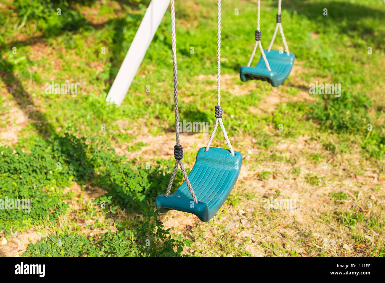 Children swing at Playground Stock Photo - Alamy