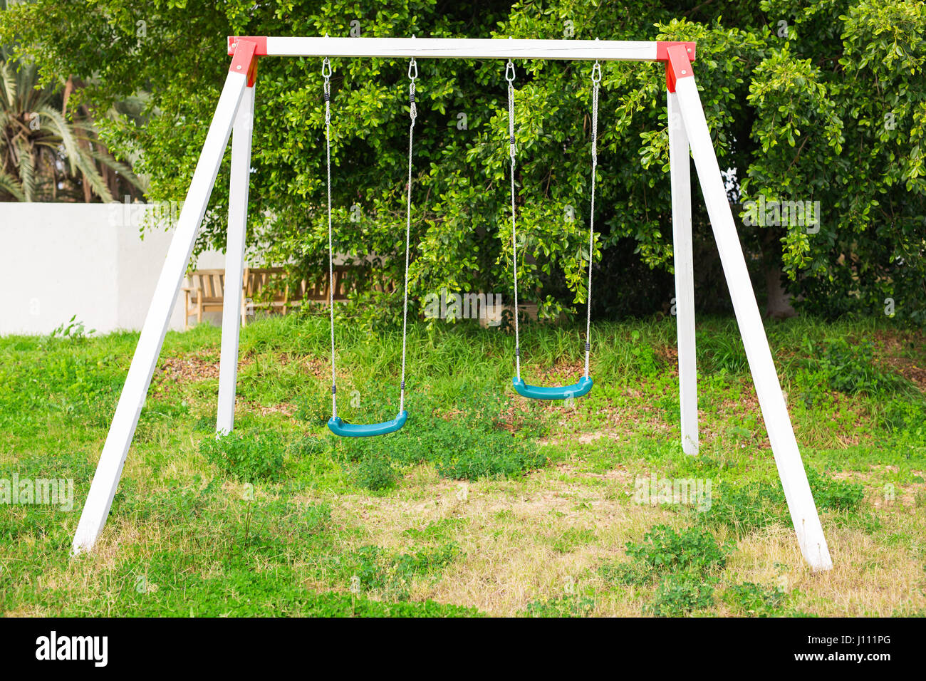 Children swing at Playground Stock Photo - Alamy